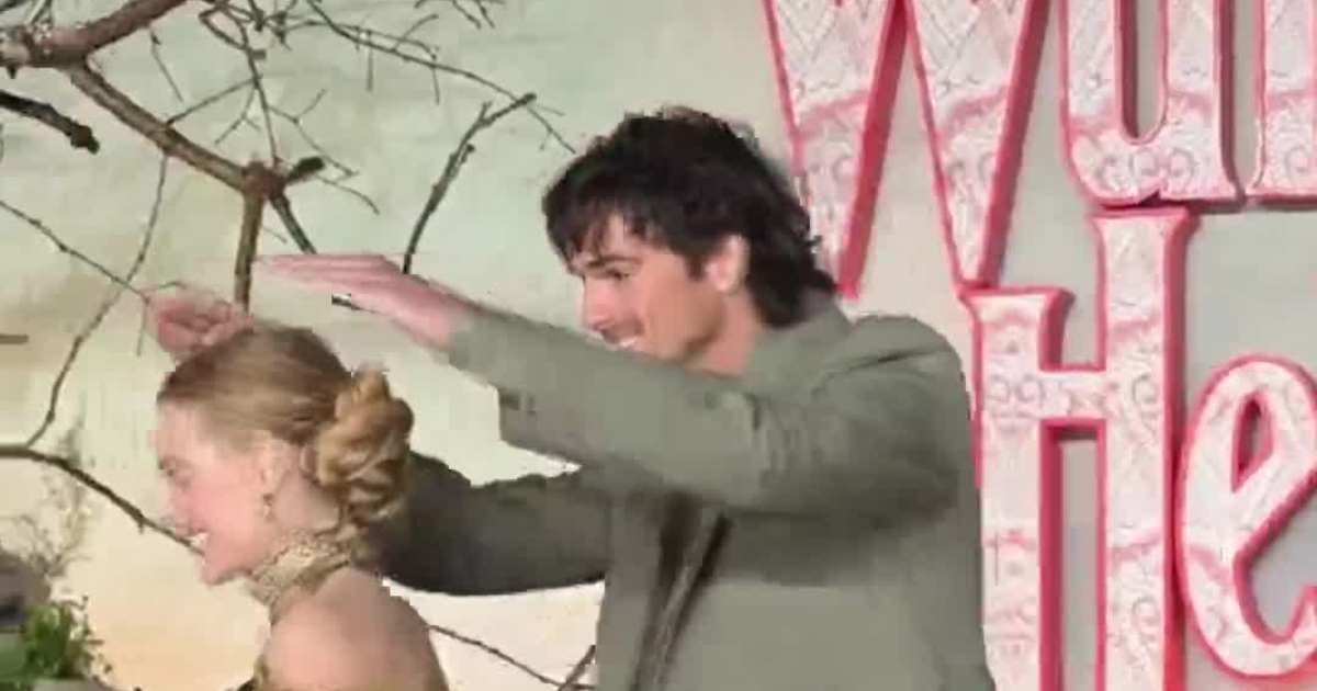 Jacob Elordi Shields Margot Robbie in the Rain at 'Wuthering Heights ...